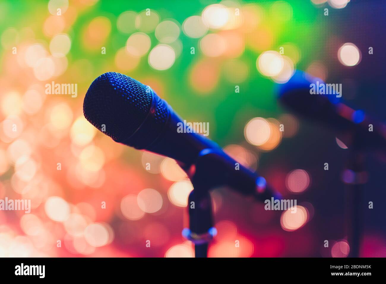 Close up of microphone on stage in audience room blur background Stock ...