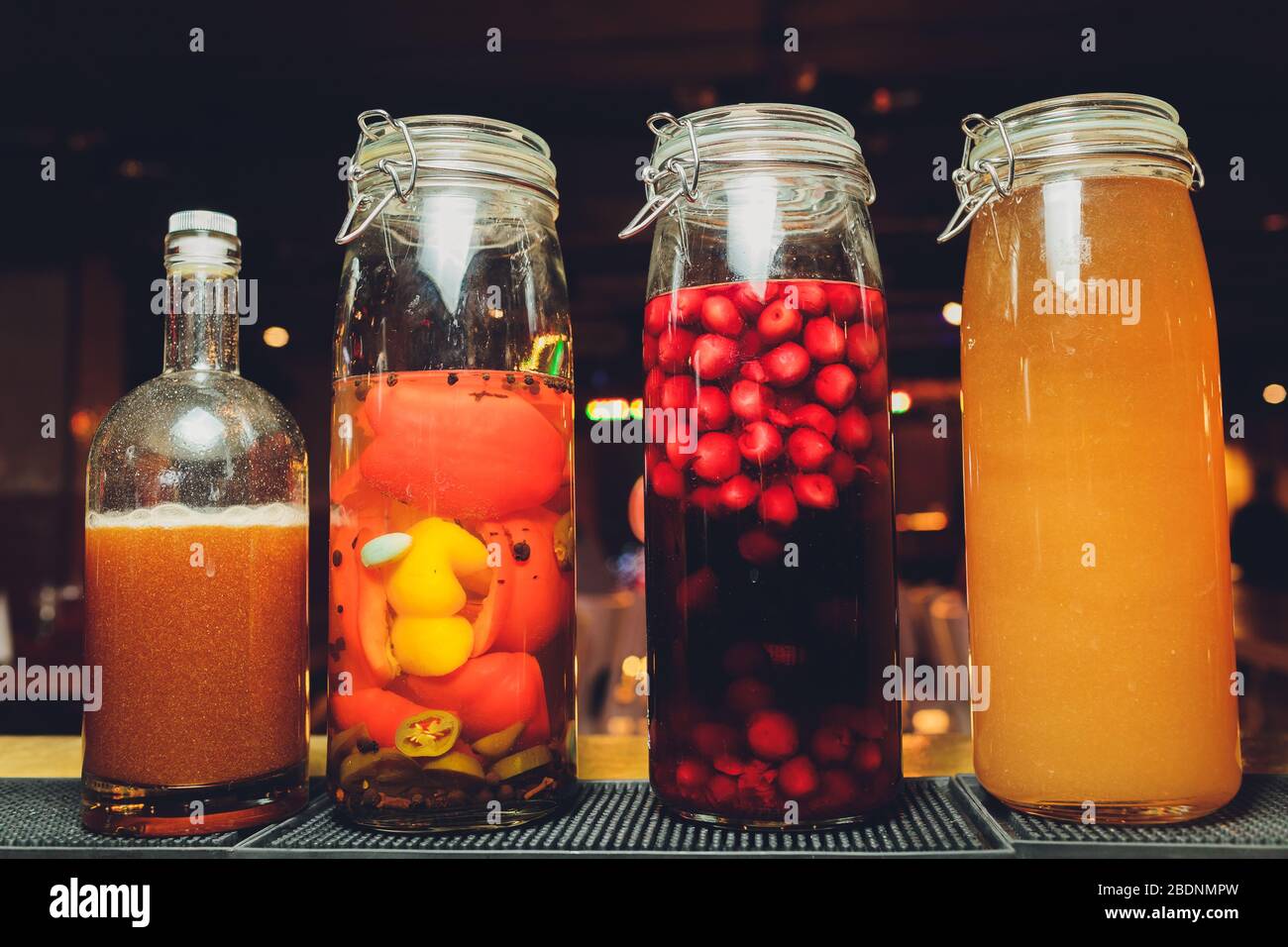 Bottles of tincture or potion and dry healthy herbs, bunch of healing ...