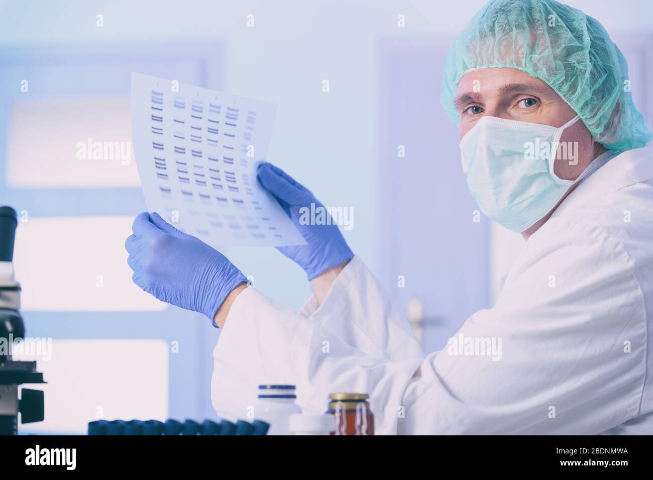 Scientist analizing DNA sequence in the modern laboratory Stock Photo ...