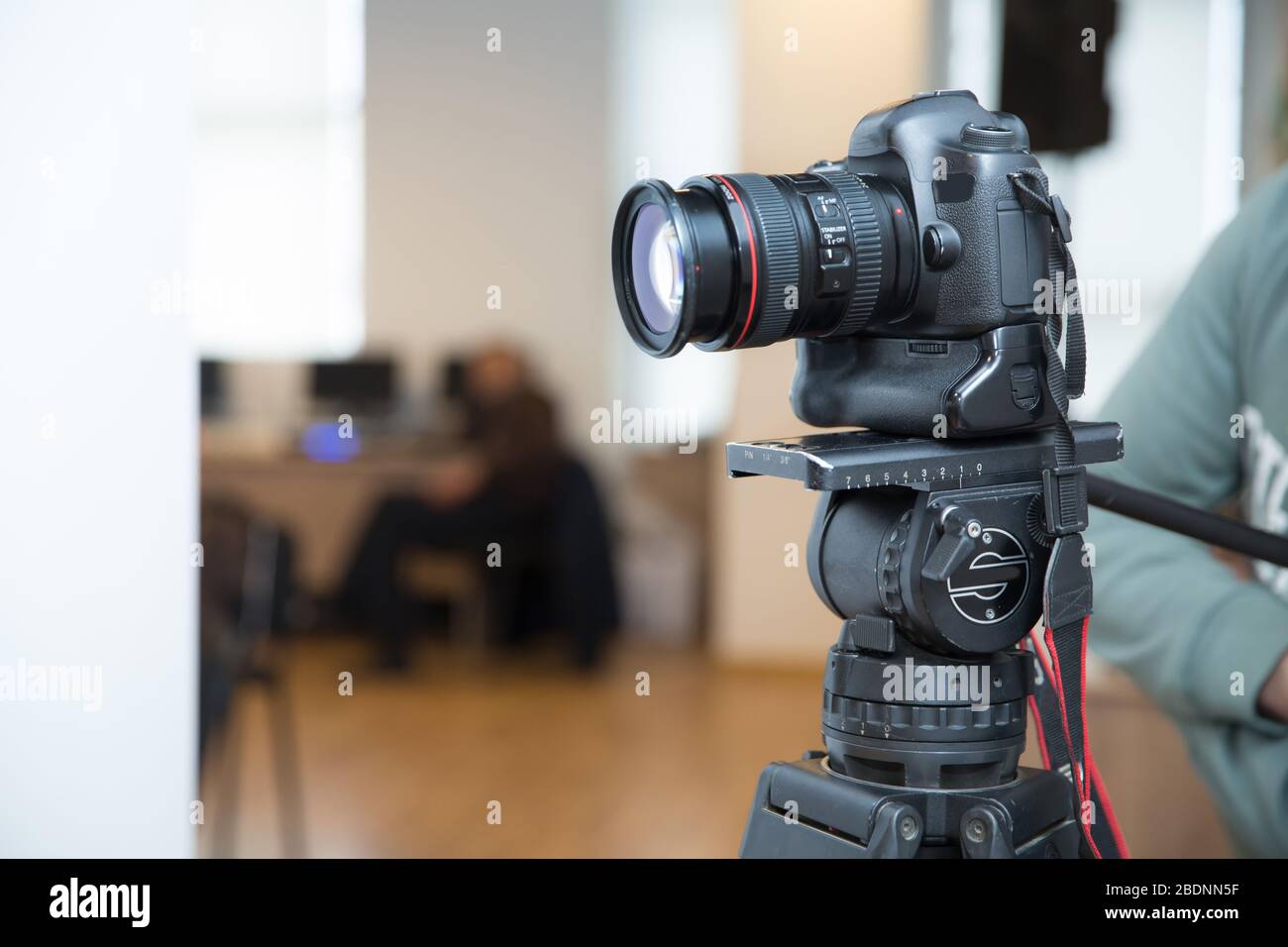 Focus on tripod mounted camera screen showing . Photo camera set on a ...