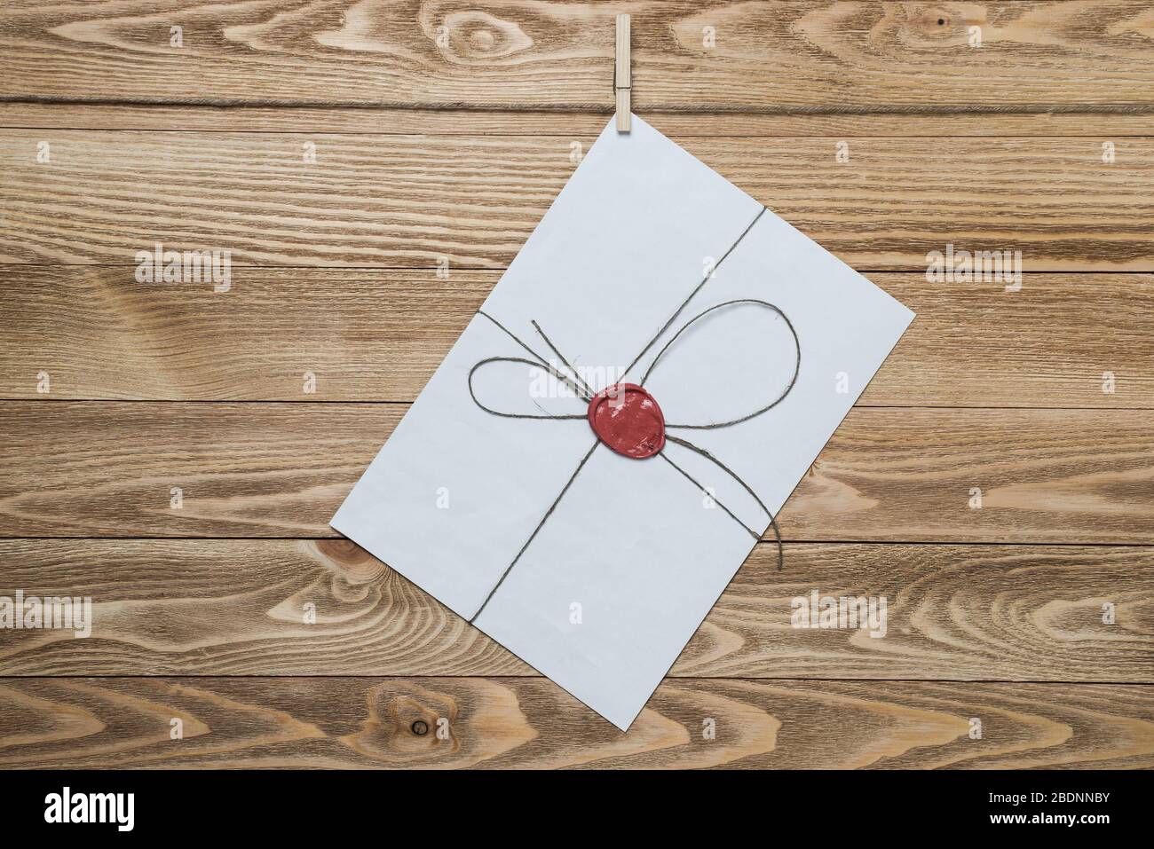 Mail envelope on rope Stock Photo - Alamy