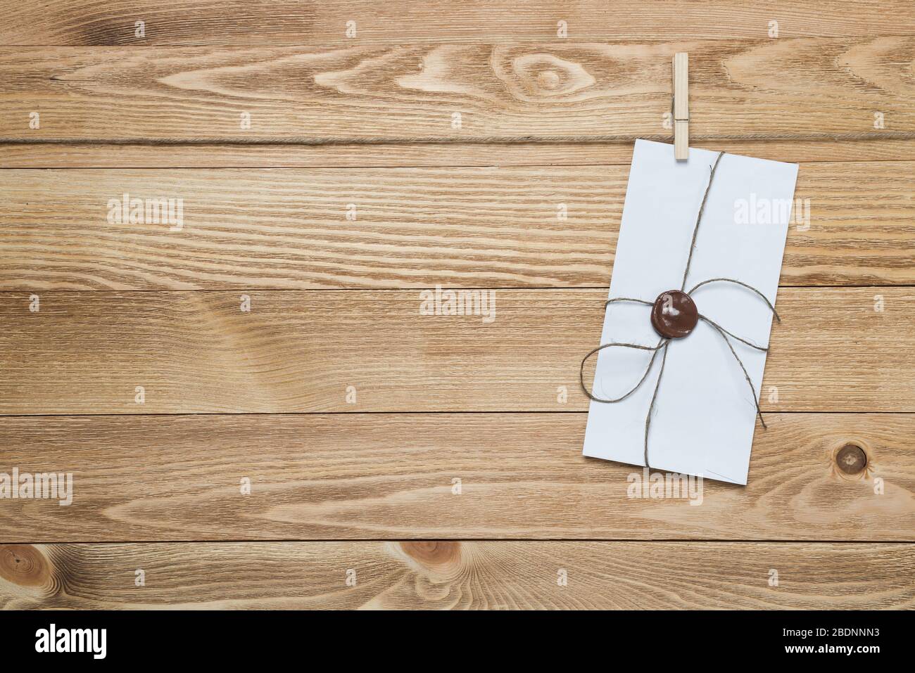 Mail envelope on rope Stock Photo - Alamy