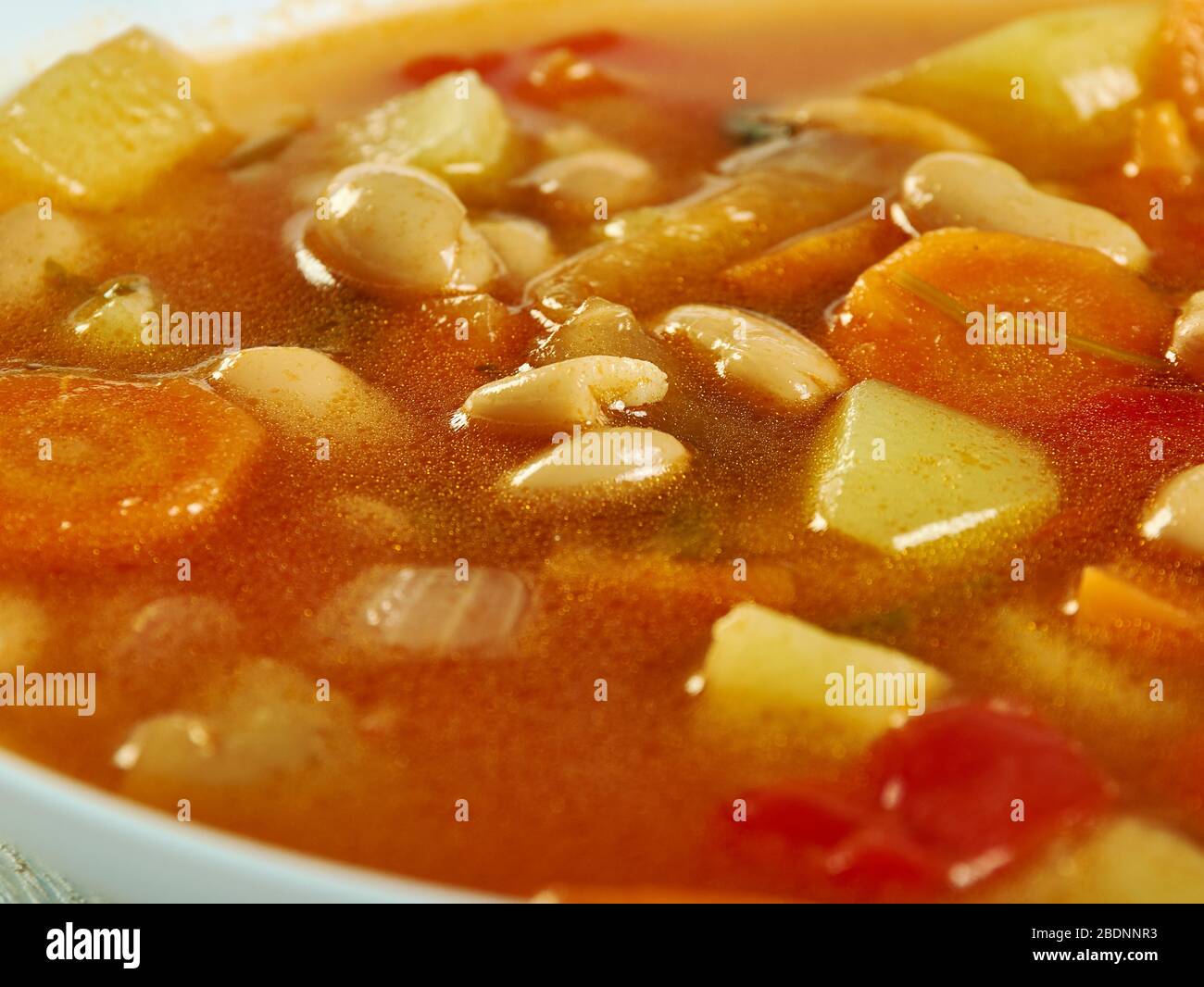 Israeli White Bean Soup, chicken broth and beans Stock Photo - Alamy
