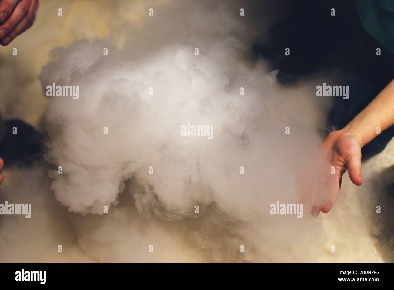 Liquid nitrogen in a glass on a black background Stock Photo - Alamy