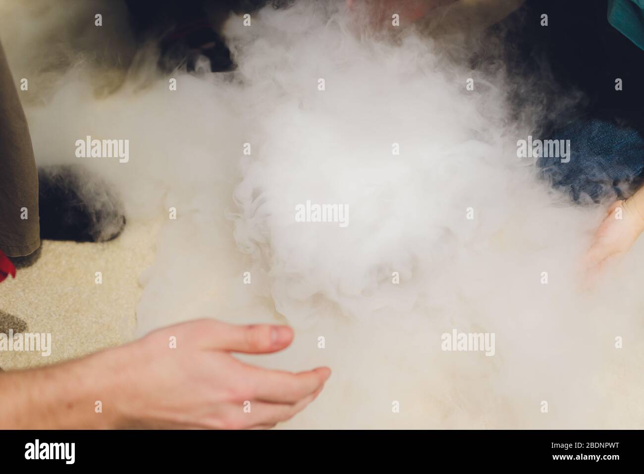 Liquid nitrogen in a glass on a black background Stock Photo - Alamy