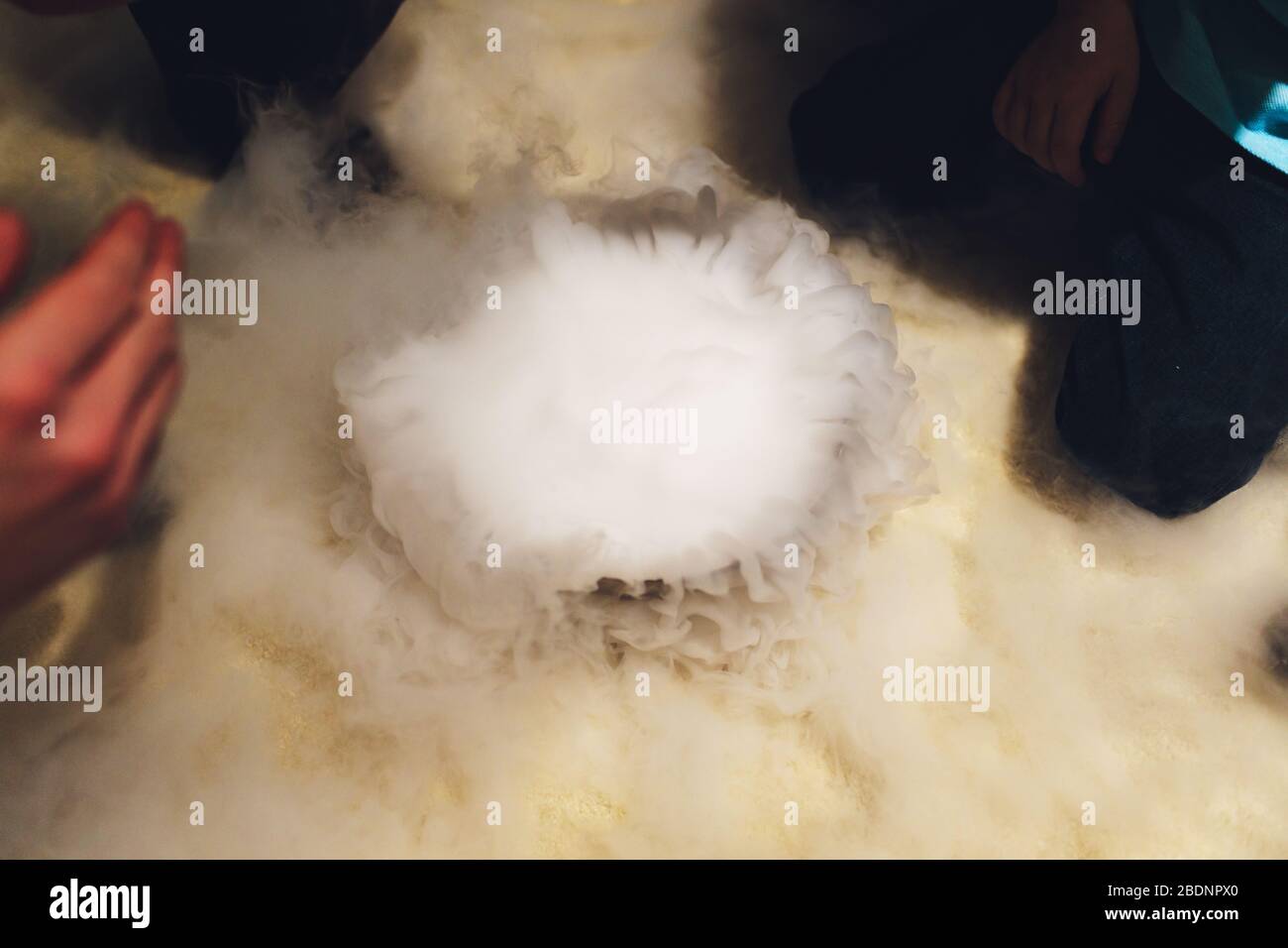 Liquid nitrogen in a glass on a black background Stock Photo - Alamy