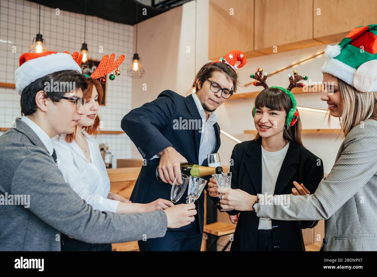 Happy colleagues in office celebrate special event Stock Photo - Alamy