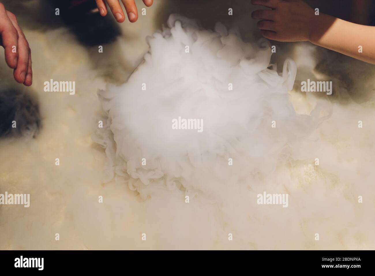 Liquid nitrogen in a glass on a black background Stock Photo - Alamy