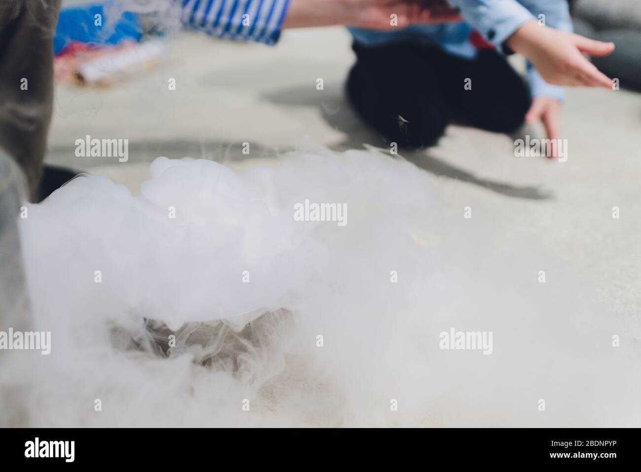 Liquid nitrogen in a glass on a black background Stock Photo - Alamy