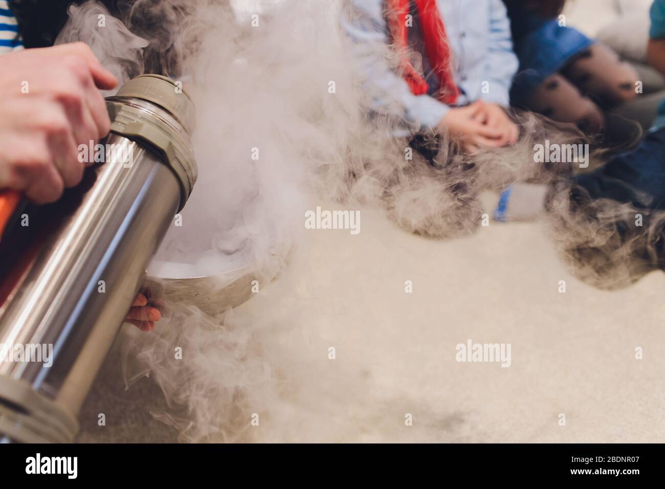 Liquid nitrogen in a glass on a black background Stock Photo - Alamy