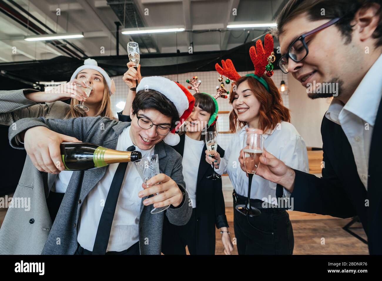 Happy colleagues in office celebrate special event Stock Photo - Alamy