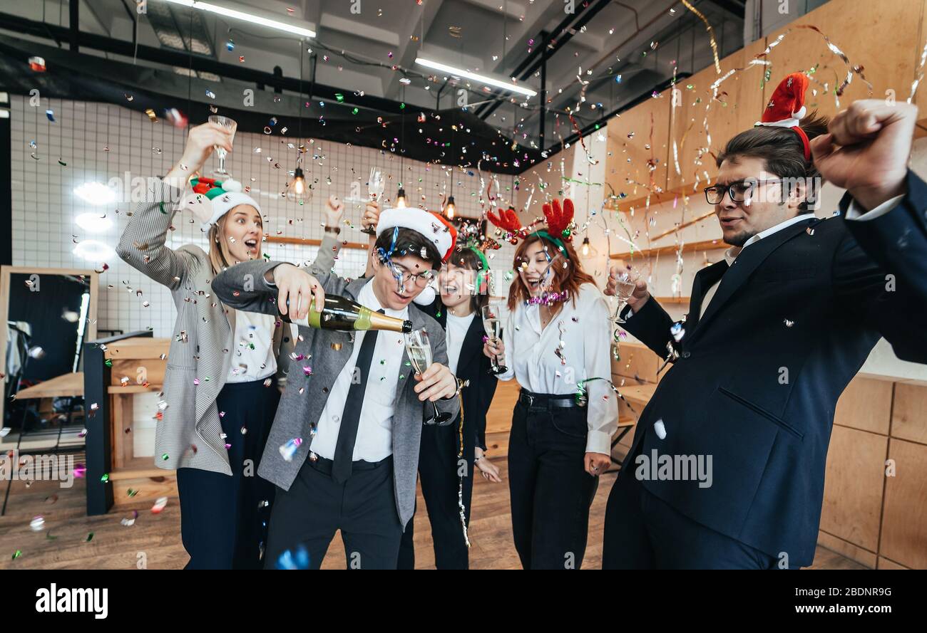 Happy colleagues in office celebrate special event Stock Photo - Alamy