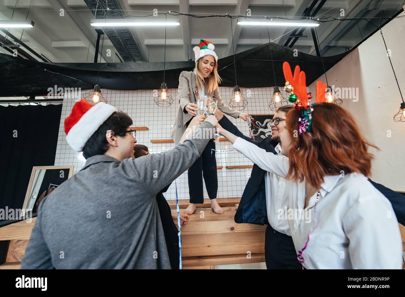 Happy colleagues in office celebrate special event Stock Photo - Alamy