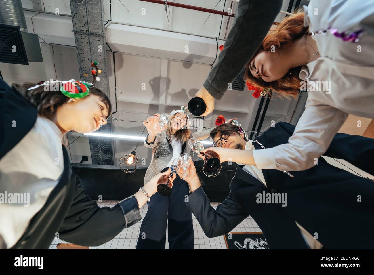 Happy colleagues in office celebrate special event Stock Photo - Alamy