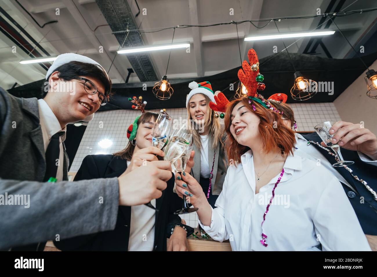 Happy colleagues in office celebrate special event Stock Photo - Alamy