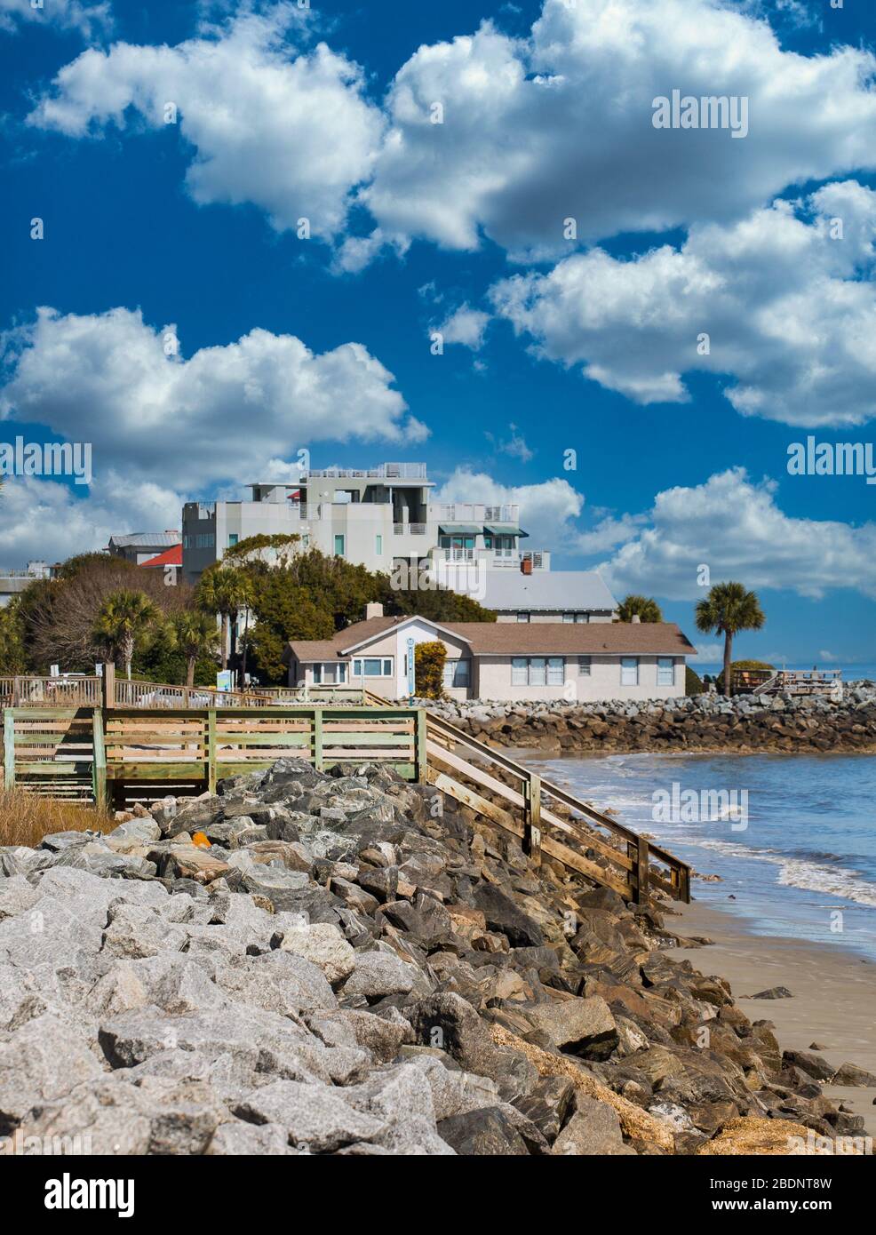 Coastal Homes Down Stone Seawall Stock Photo - Alamy