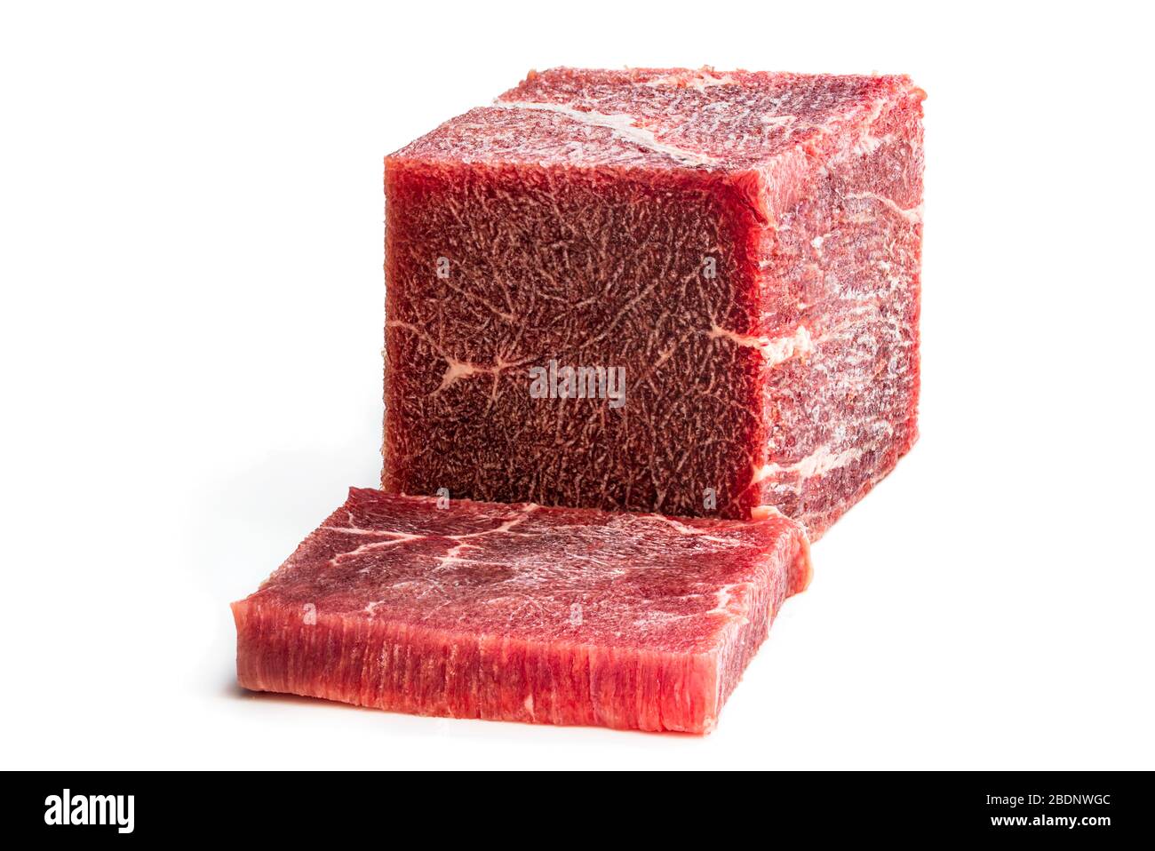 Piece of frozen meat cubic shape concept of routinely eaten food Stock ...