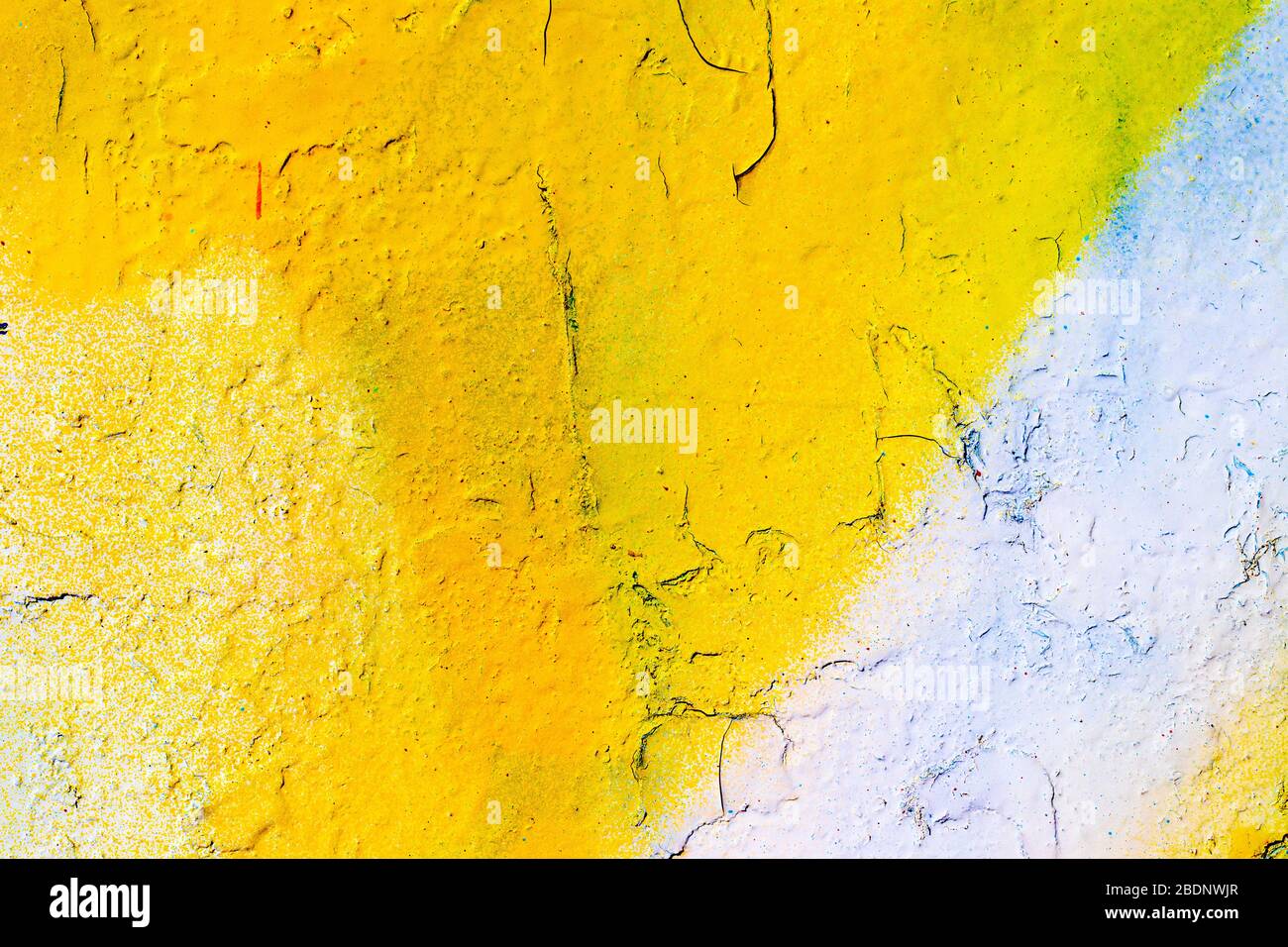 Fragment of colorful graffiti painted on a concrete wall. Bright yellow ...