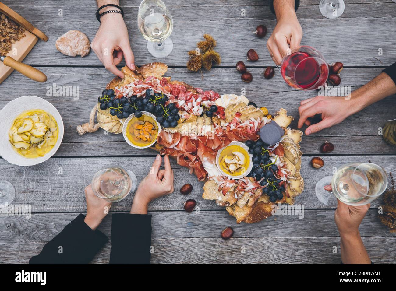 Top down of traditional rustic dinner in South Tyrol with friends Stock ...