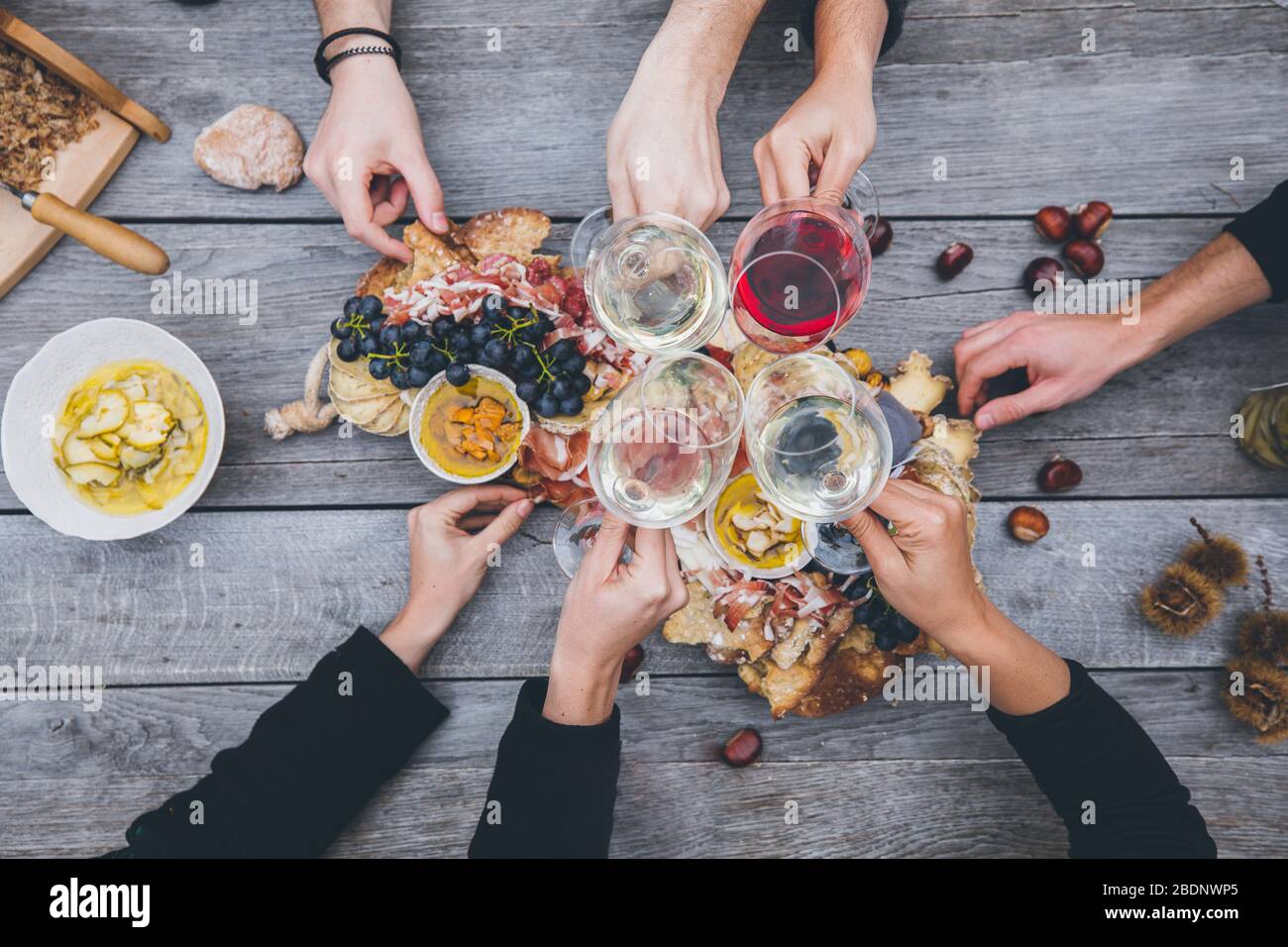 Top down of traditional rustic dinner in South Tyrol with friends Stock ...