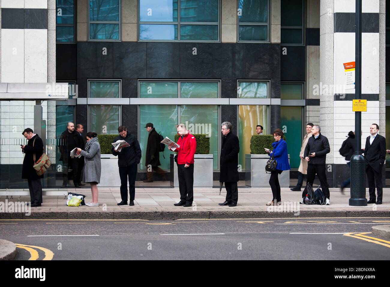 London, UK - 15 January 2020 Queue at the bus stop. People are waiting ...