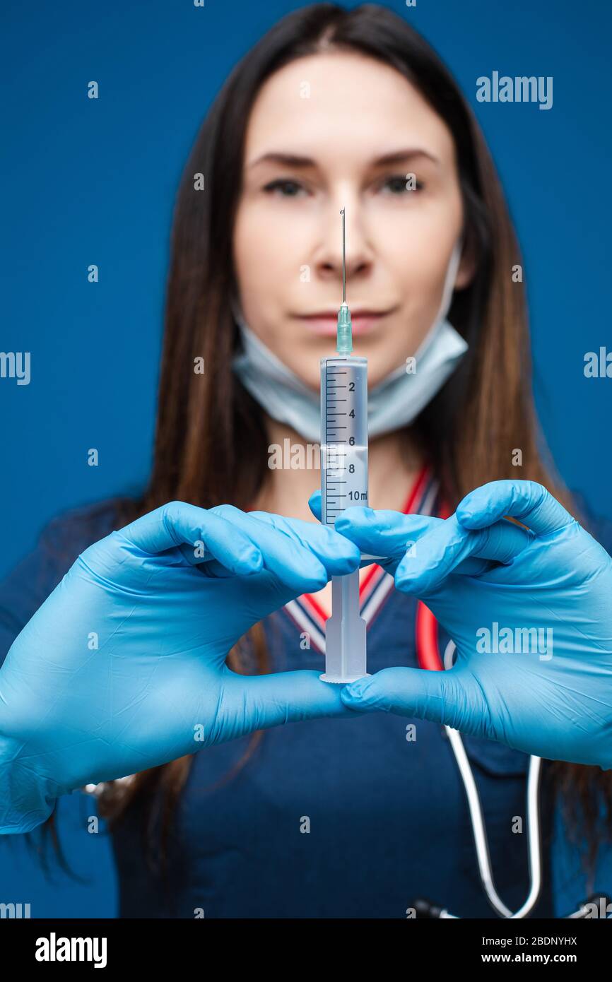 Beautiful Woman Doctor In White Medical Clothes Mask Blue Gloves And
