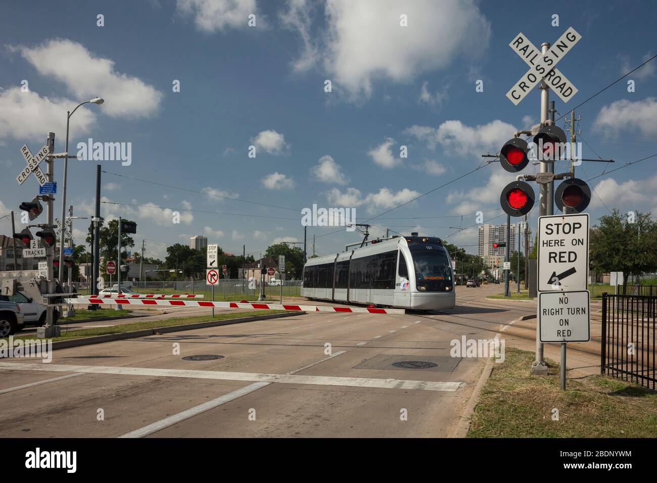 Horizontal view of a tram arriving at Wheeler station while the road ...