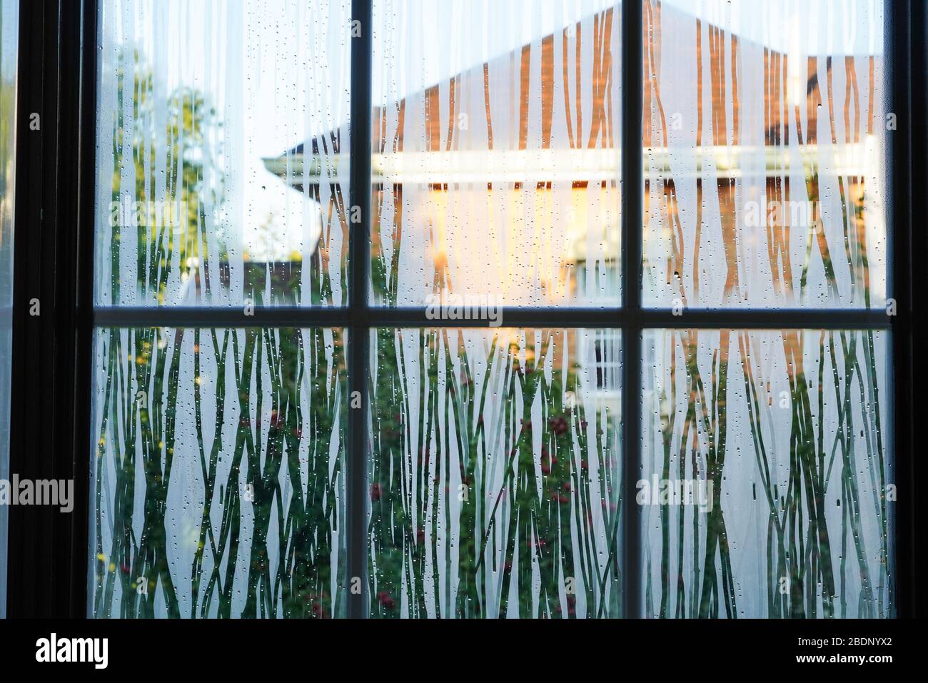 Look through the window of the rain the weather clears villa Stock ...