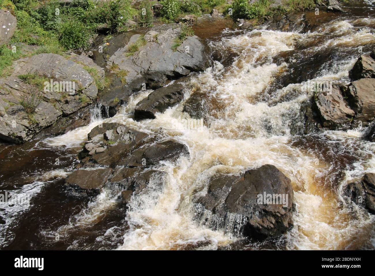 A Fast River Flowing Over Rocky Outcrops Stock Photo - Alamy