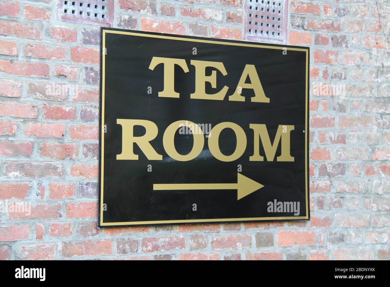 A Wall Sign Showing the Direction to a Tea Room Stock Photo - Alamy