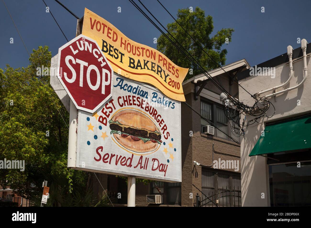 Slanted view of the colorful Acadian Bakers sign in West Alabama St ...