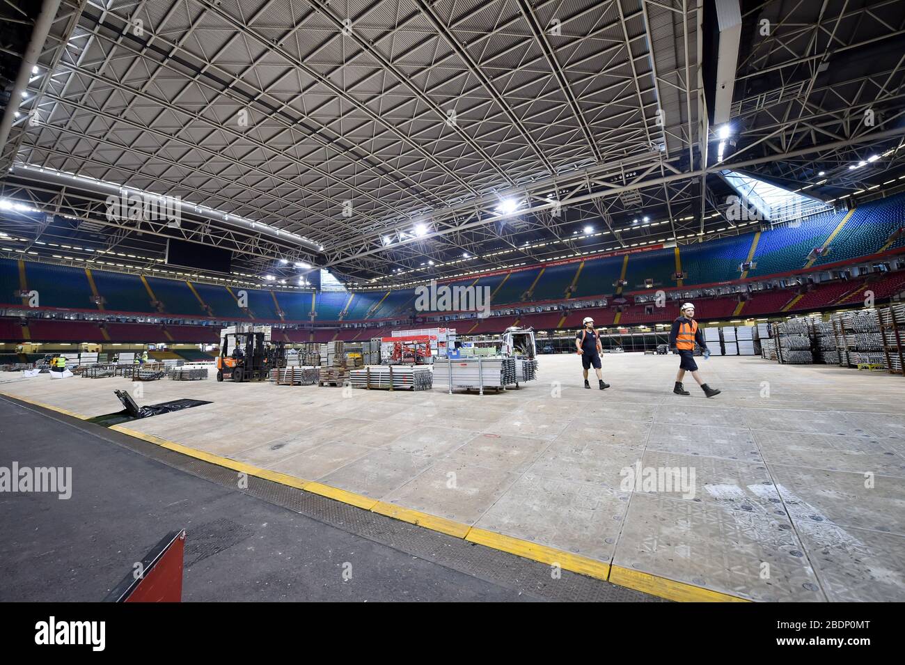 No grass can be seen as a floor is laid inside the Principality Stadium ...