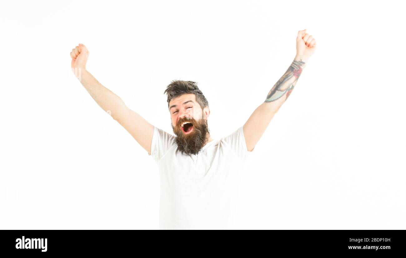 Hipster with beard stretching arms, energetic and successful macho ...