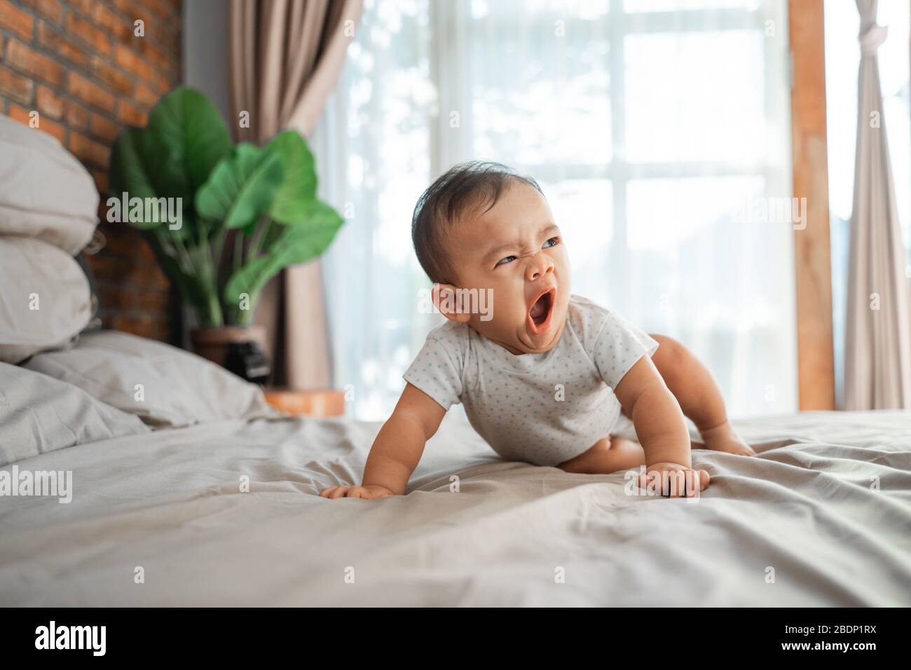 Asian boy wake up bed hi-res stock photography and images - Alamy