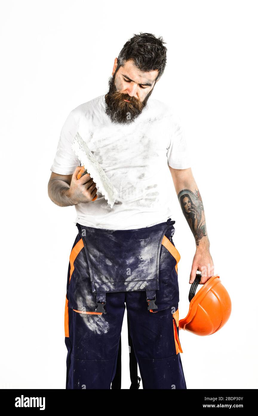 Tool, trowel, handyman, man builder holds plastering tool. Builder with ...
