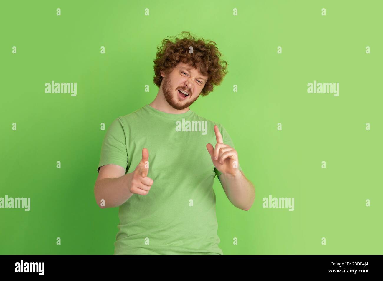 Choosing crazy, pointing. Caucasian young man's monochrome portrait on ...