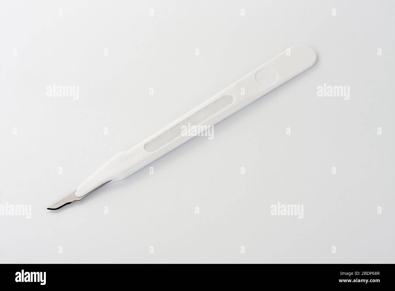Close up of medical scalpel on white background. Scalpel is used for ...