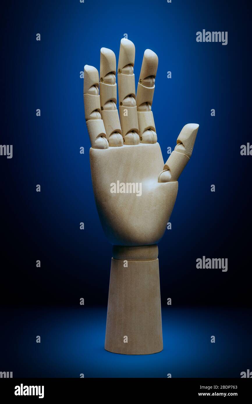 Artificial intelligence wooden hand front view with an open hand on a ...