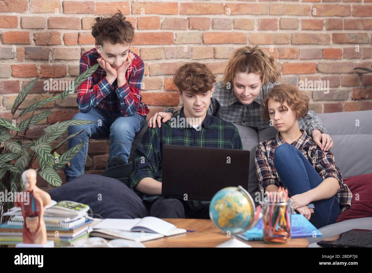 Group of young happy friends resting at home. young people spending ...