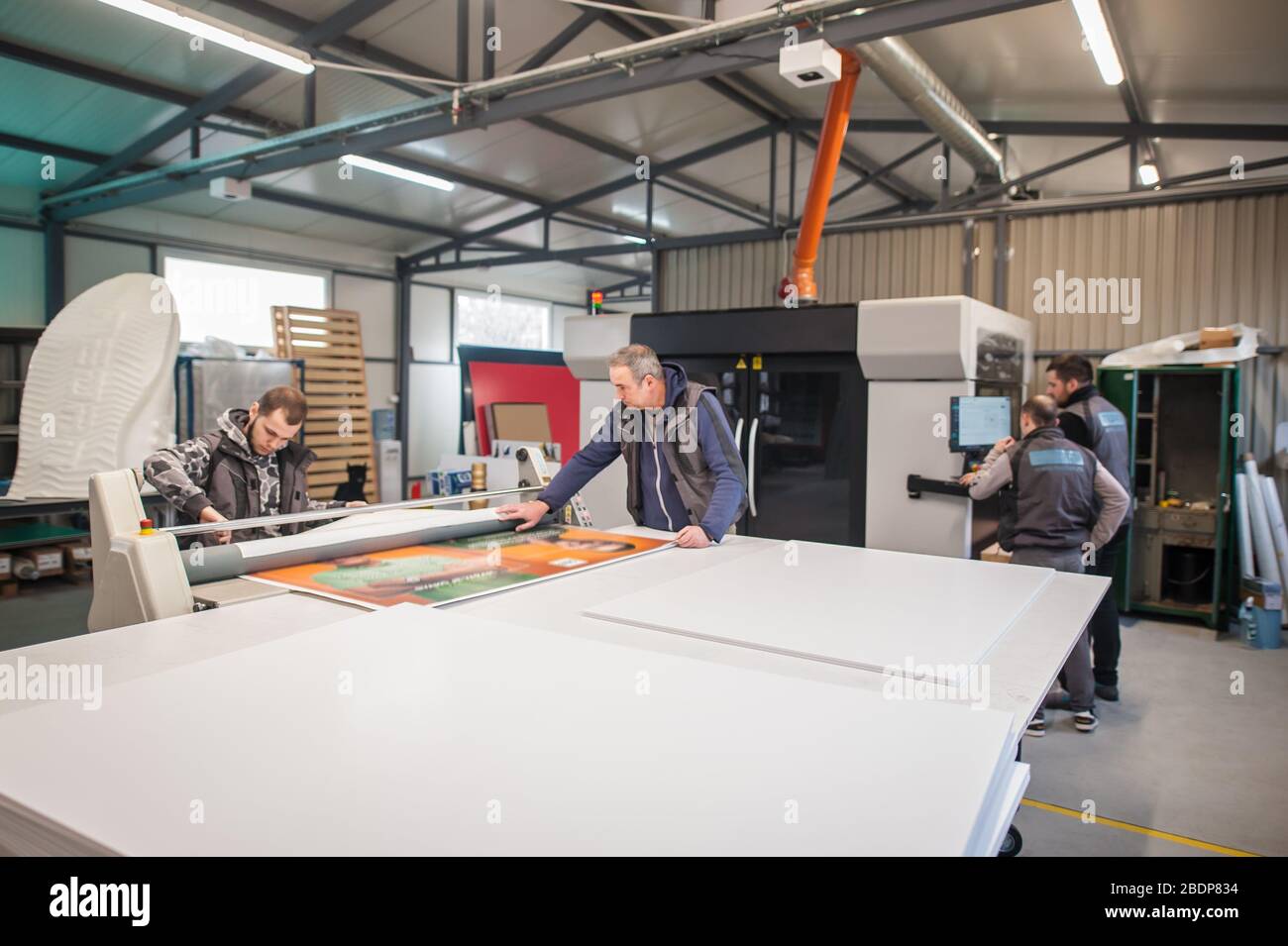 Large group of worker printmaker technician operator works in digital ...