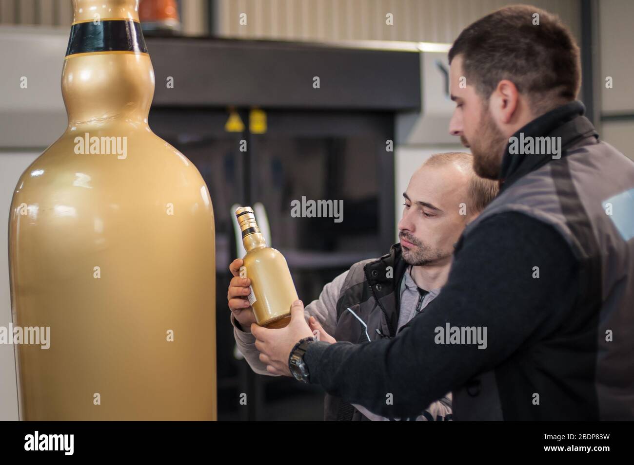 Technician doing post production, finishing and processing of the large ...