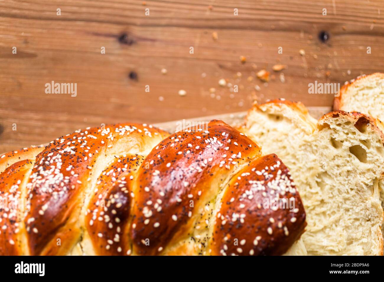Sliced fresh challah bread on the wood table Stock Photo - Alamy