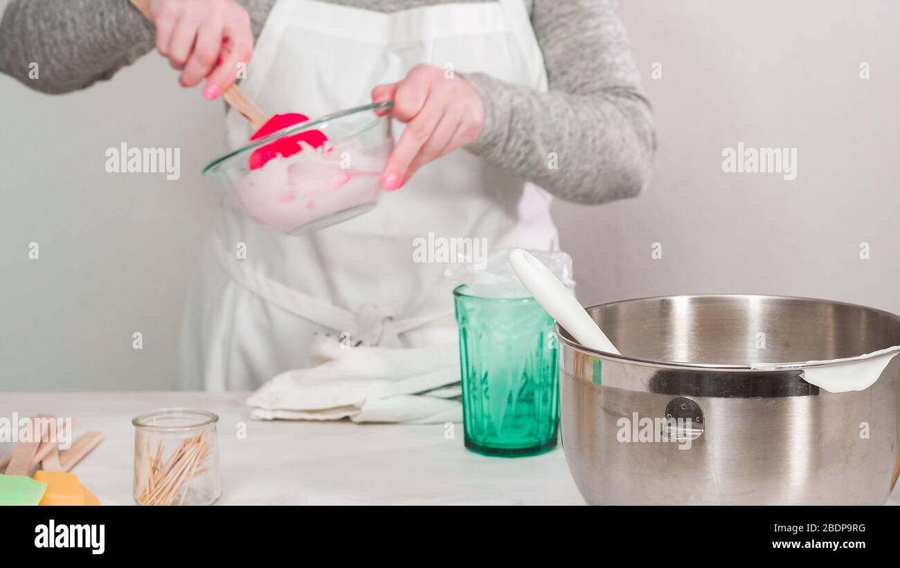 Step by step. Flat lay. Mixing royal icing in electric kitchen mixer ...