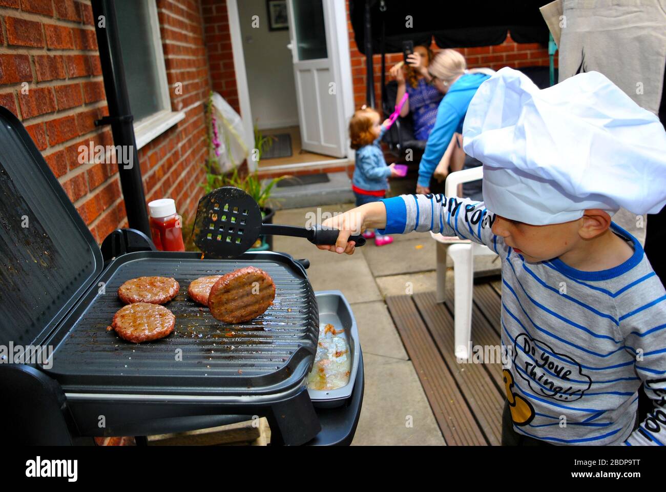 Flipping Burgers High Resolution Stock Photography and Images - Alamy