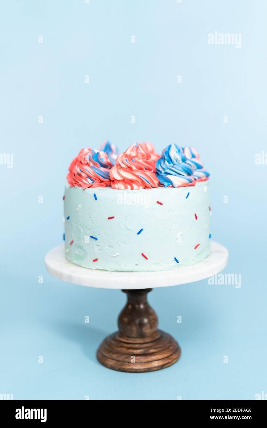 Red, white, and blue round cake frosted with buttercream frosting Stock ...