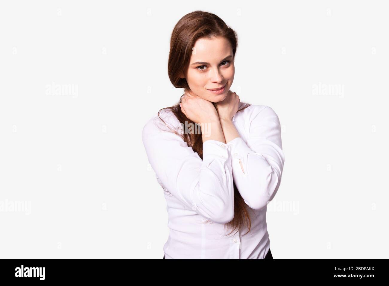 Cute lovely girl tenderly holding hands on neck. Isolated on white ...