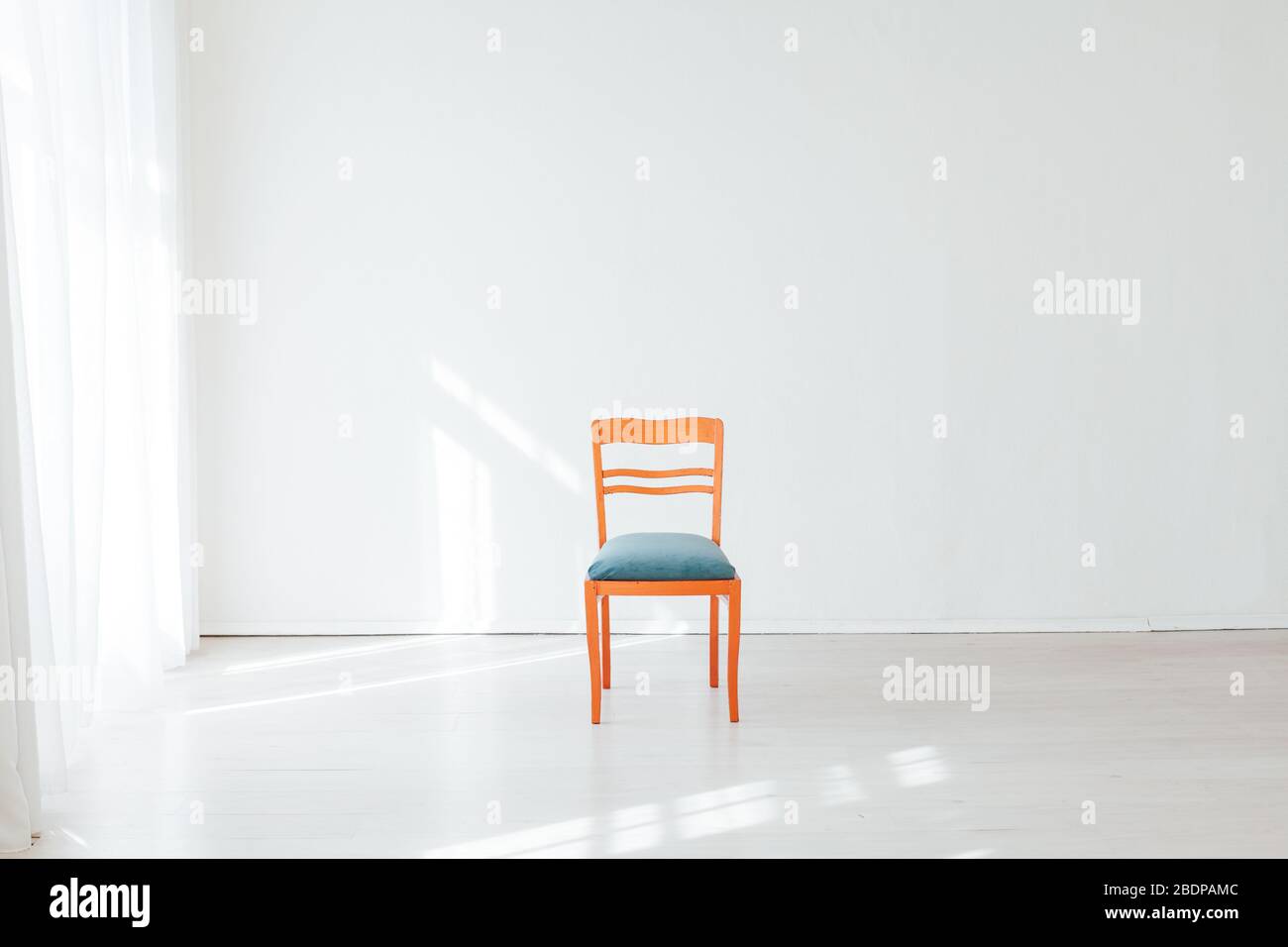 one chair in the interior of an empty white room Stock Photo - Alamy
