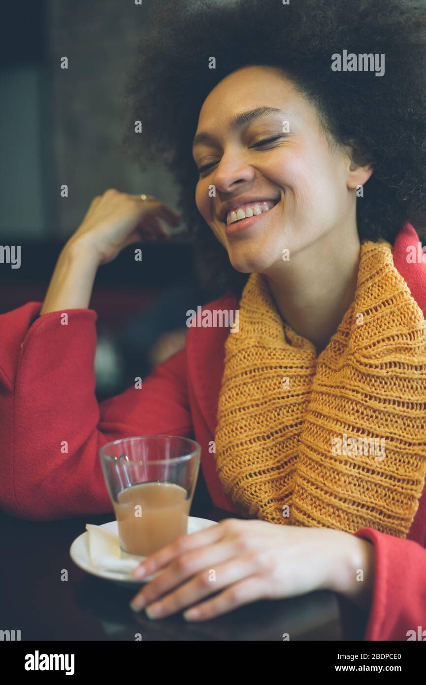 Portrait of beautiful young woman enjoying tea in a restaurant Stock ...