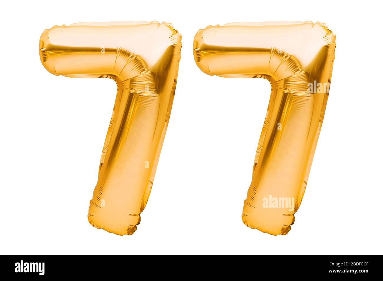 Number 77 seventy seven made of golden inflatable balloons isolated on ...