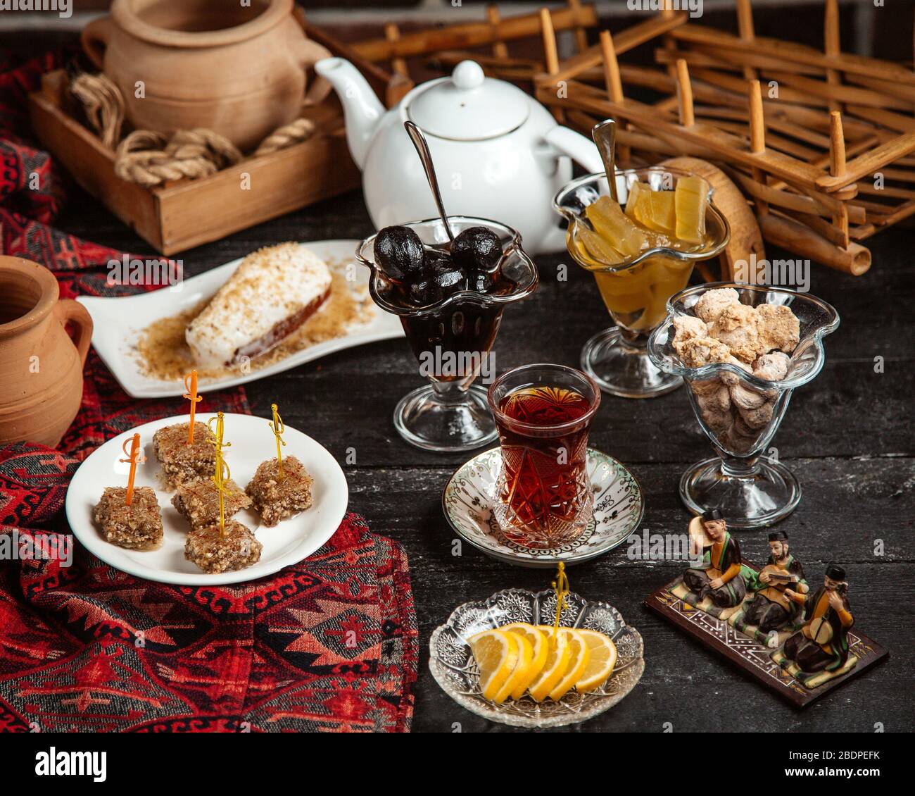 black tea in armudu glass with various sweets Stock Photo - Alamy